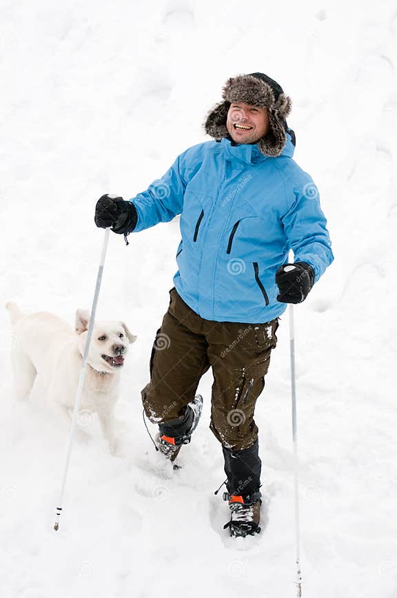 Snowshoeing with dog stock image. Image of people, cool - 17491907