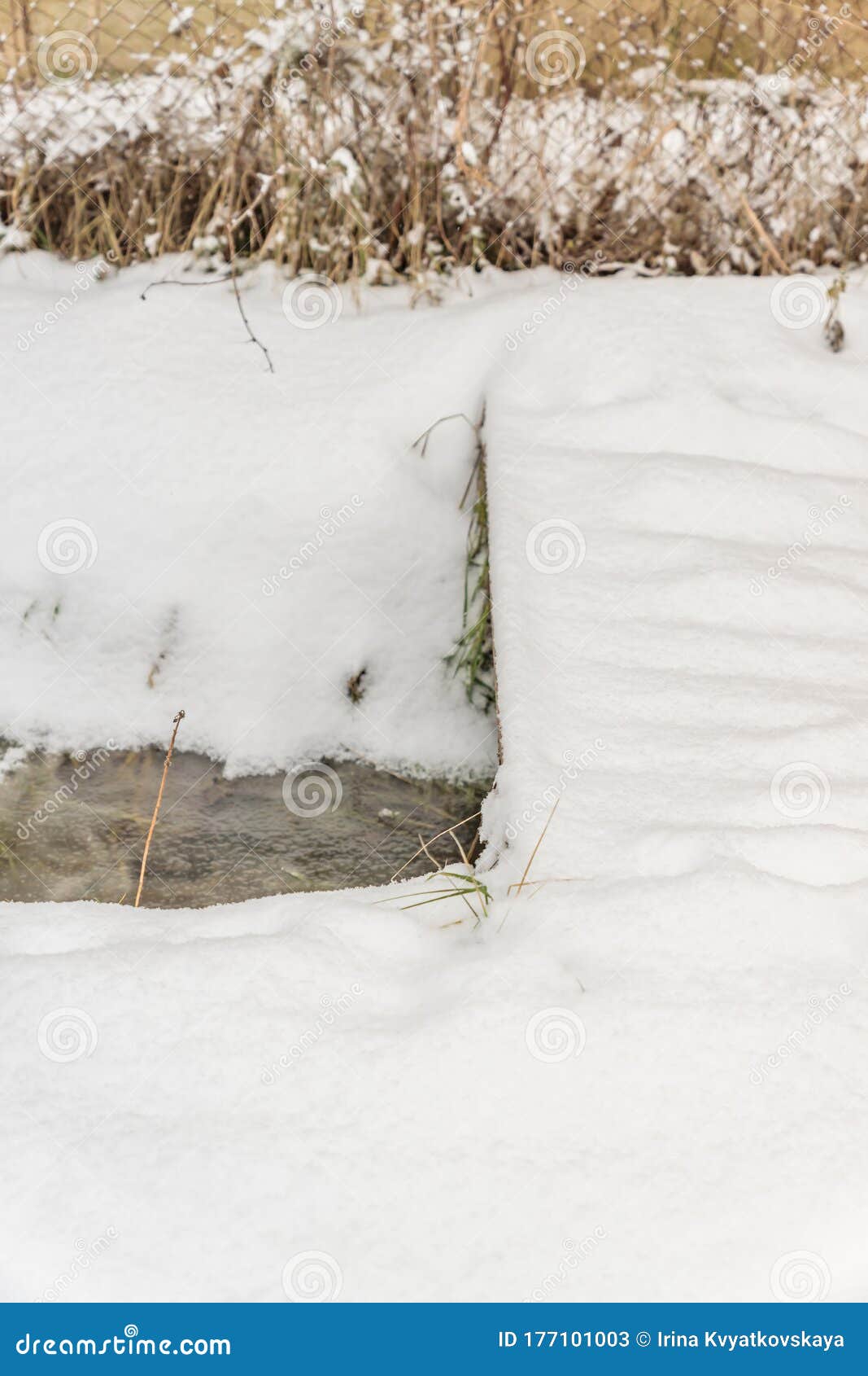 Snowy Bridge Over a Stream Covered with Ice Stock Image - Image of ...