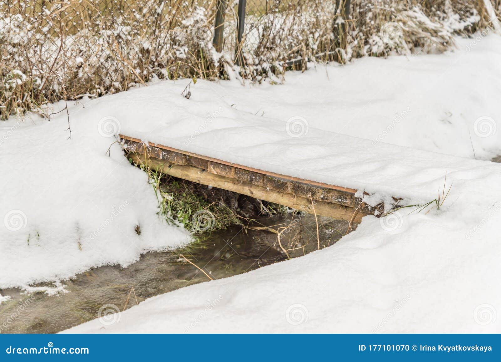 Snowy Bridge Over a Stream Covered with Ice Stock Photo - Image of snow ...