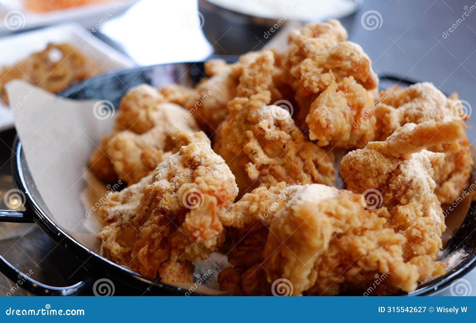 Snowy Cheese Korean Fried Chicken on a Black Plate. Stock Image - Image ...
