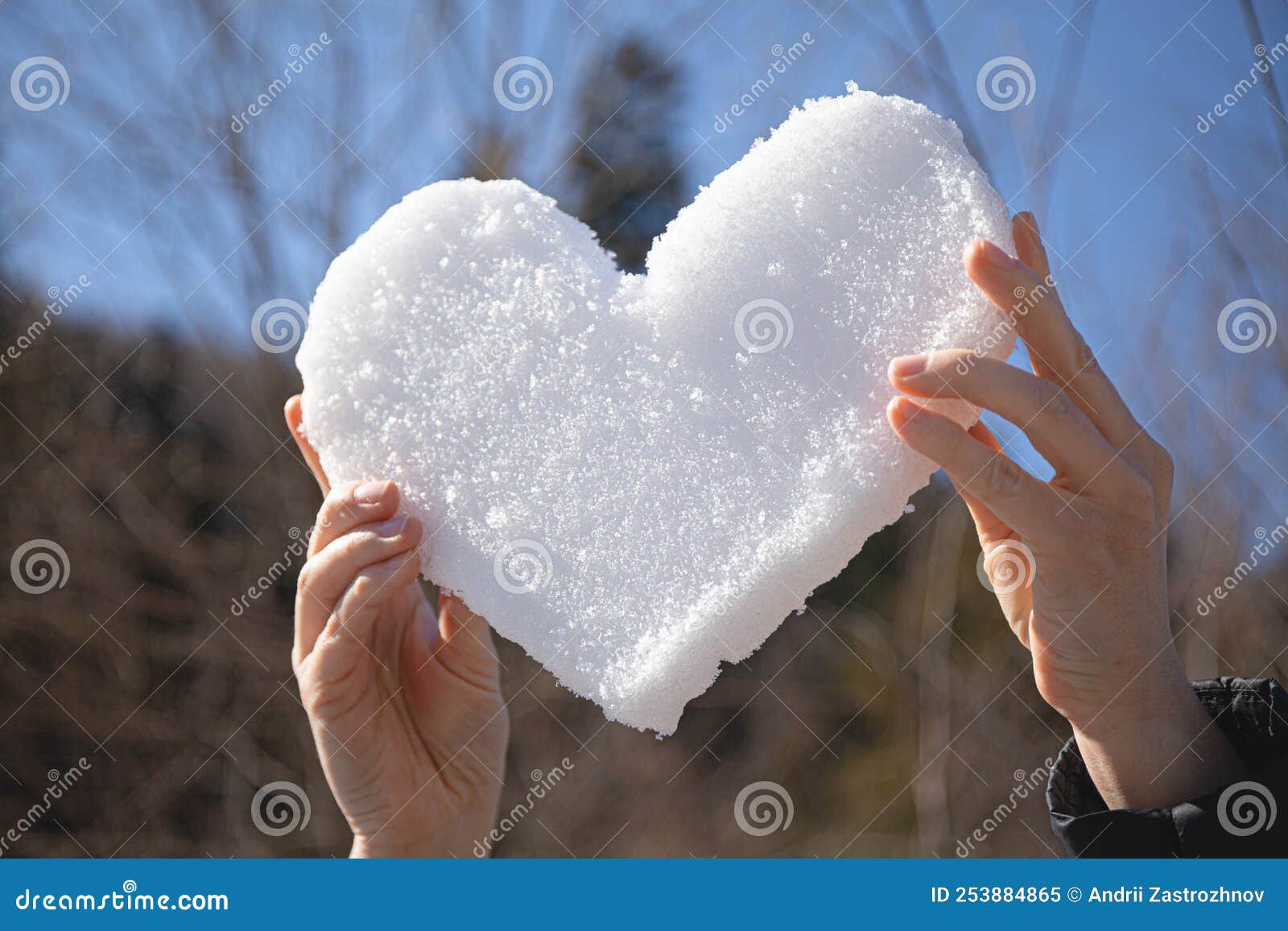 Snowy Heart in the Hands in the Sun. Winter Holidays Stock Image ...
