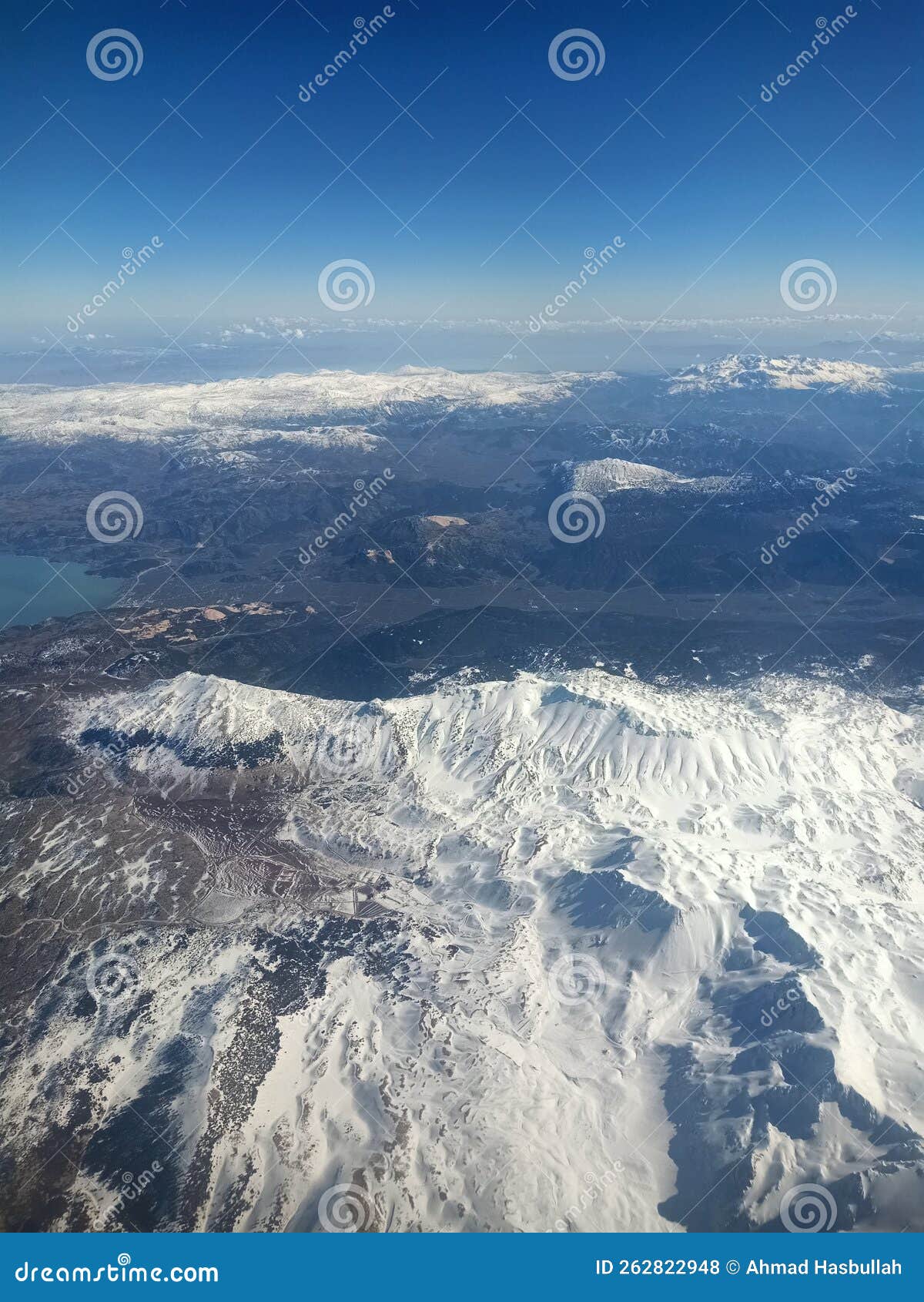 Snowy mountain from above stock photo. Image of flight - 262822948