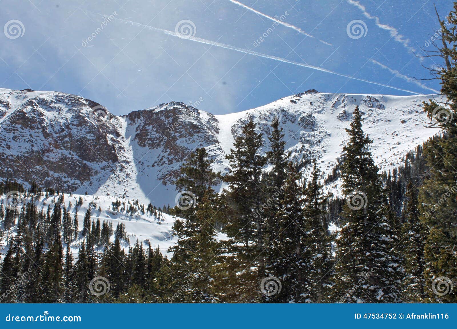 Snowy Mountains after a Flyover Stock Photo - Image of mountains, jets ...