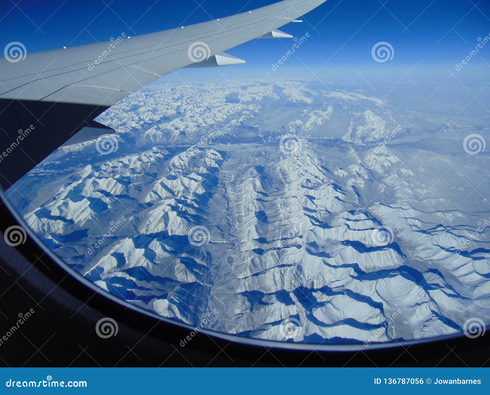 Snowy Mountains from a Plane Stock Photo - Image of blue, snow: 136787056
