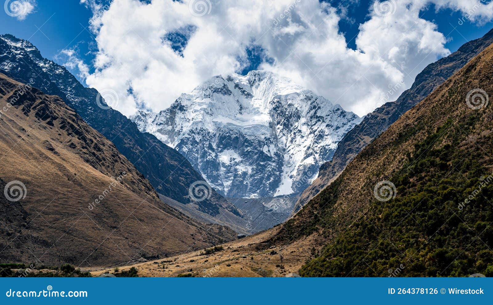 A Snowy Peak of a Mountain Covered with Clouds in Peru Stock Photo ...