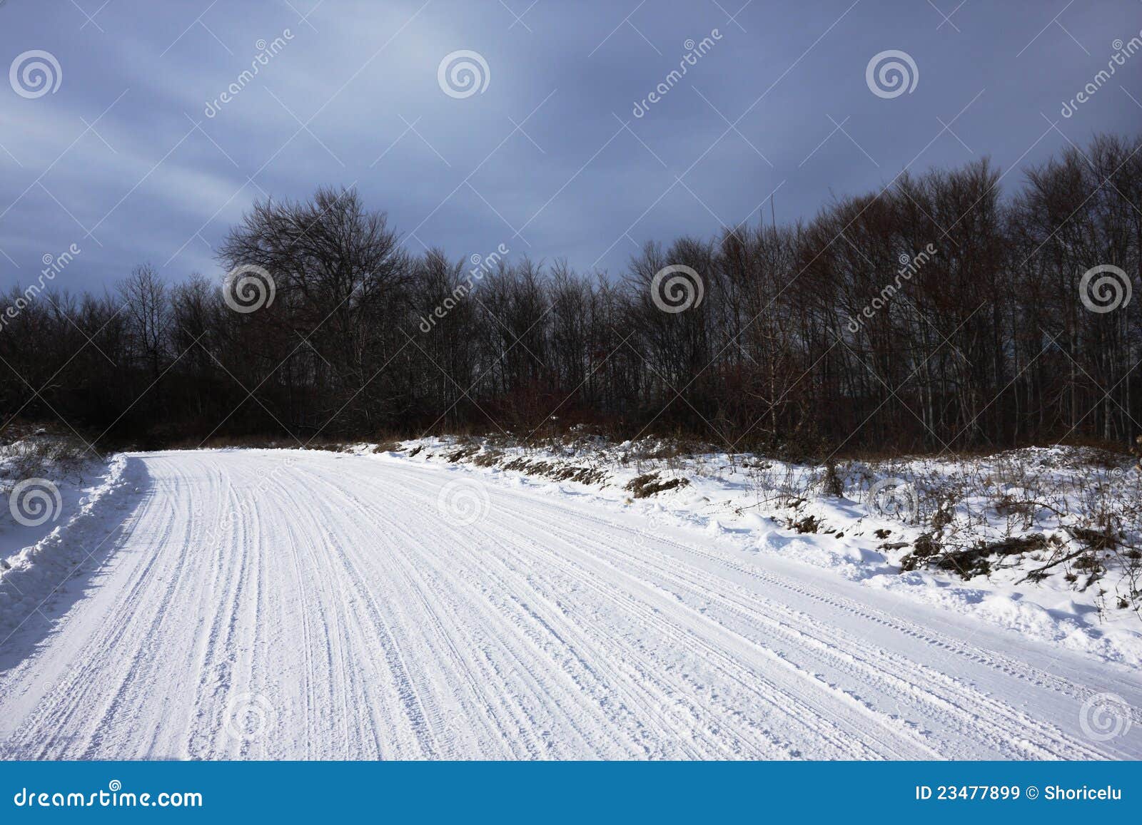 Snowy road with tracks stock image. Image of slippery - 23477899