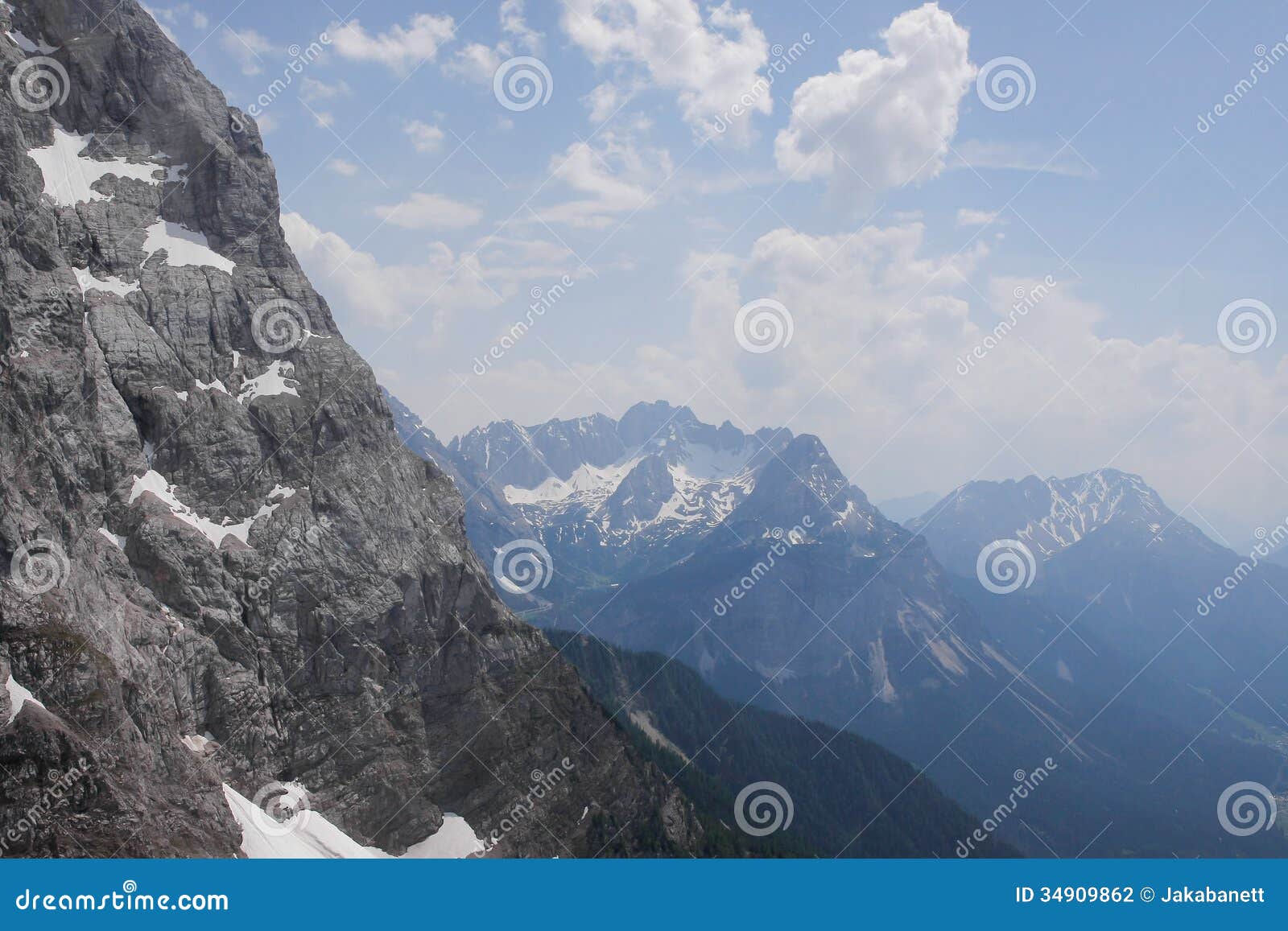 Snowy Rocks with Some Mountains in the Background Stock Photo - Image ...