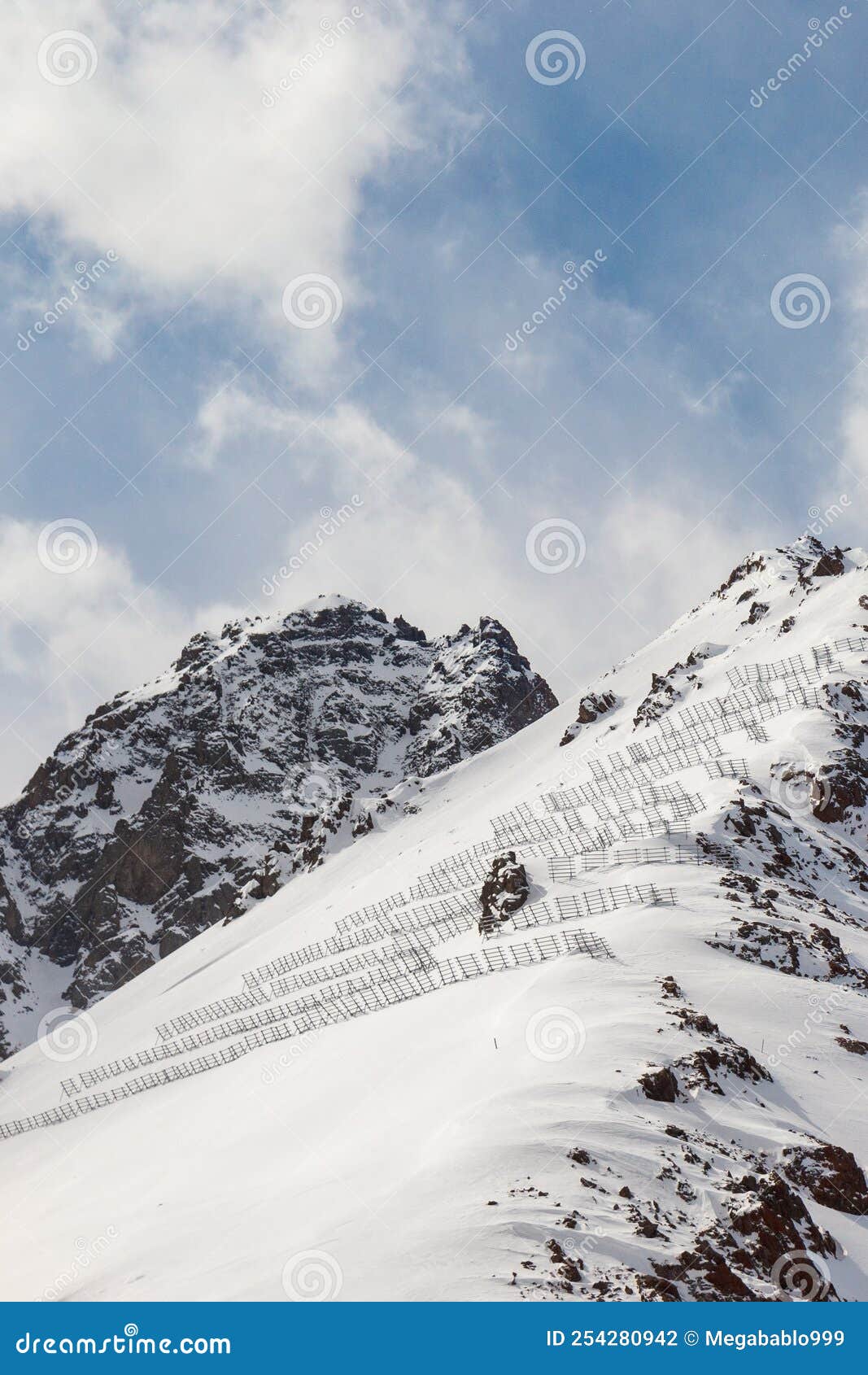 Snowy Rocky Mountains with Avalanche Protection Barriers, Vertical Copy ...