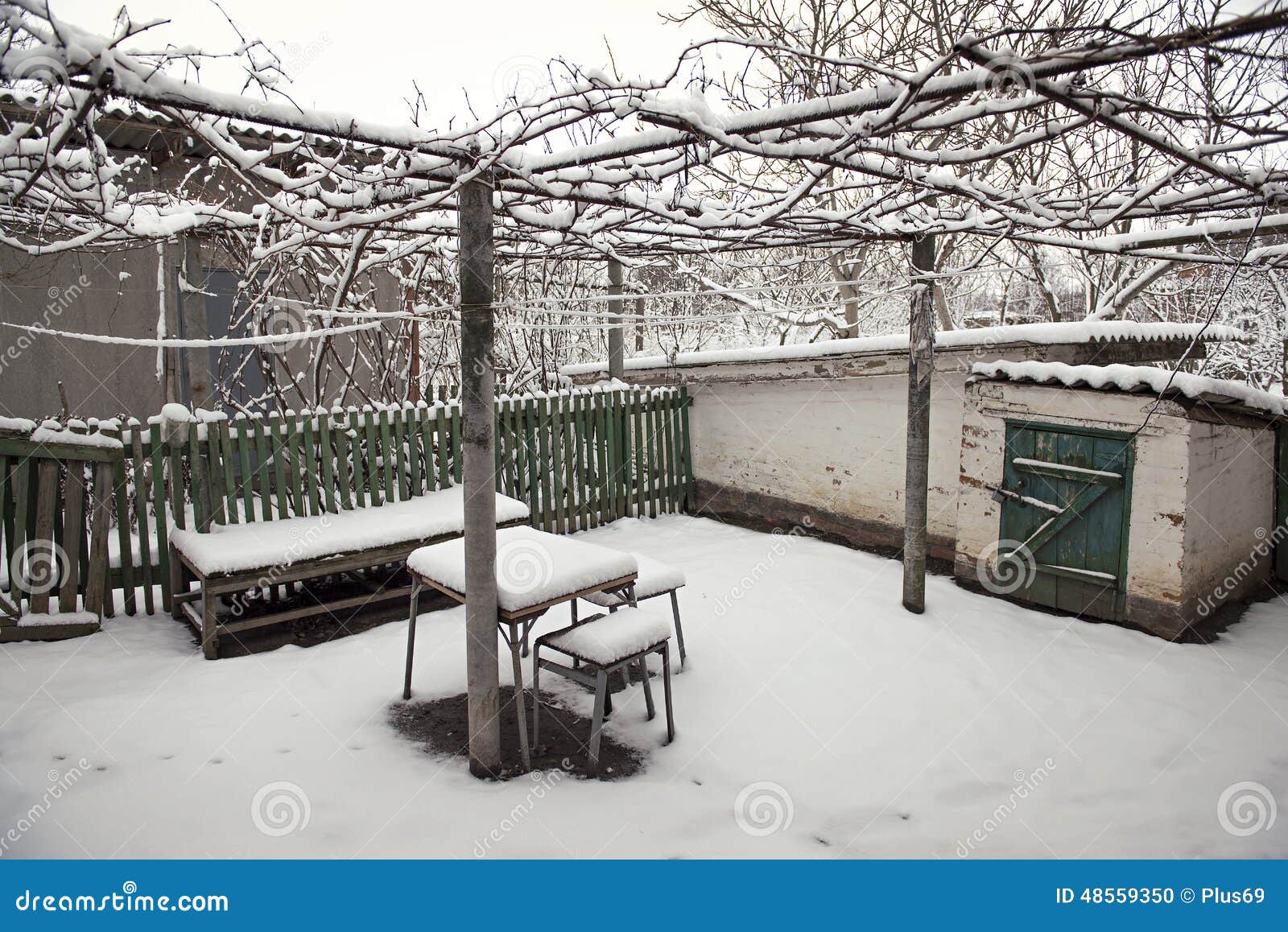 Snowy Rural Courtyard with Homemade Table, Chairs and Bench Stock Photo ...