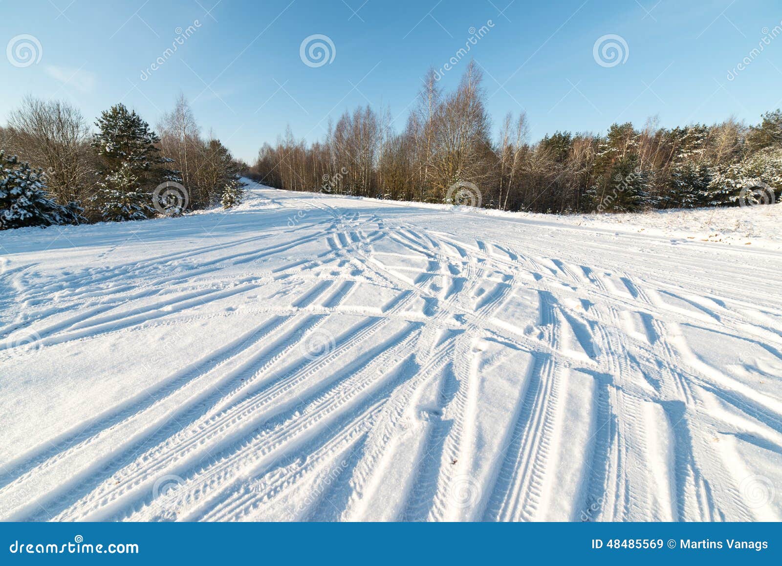 Snowy Winter Road with Tire Markings Stock Image - Image of background ...