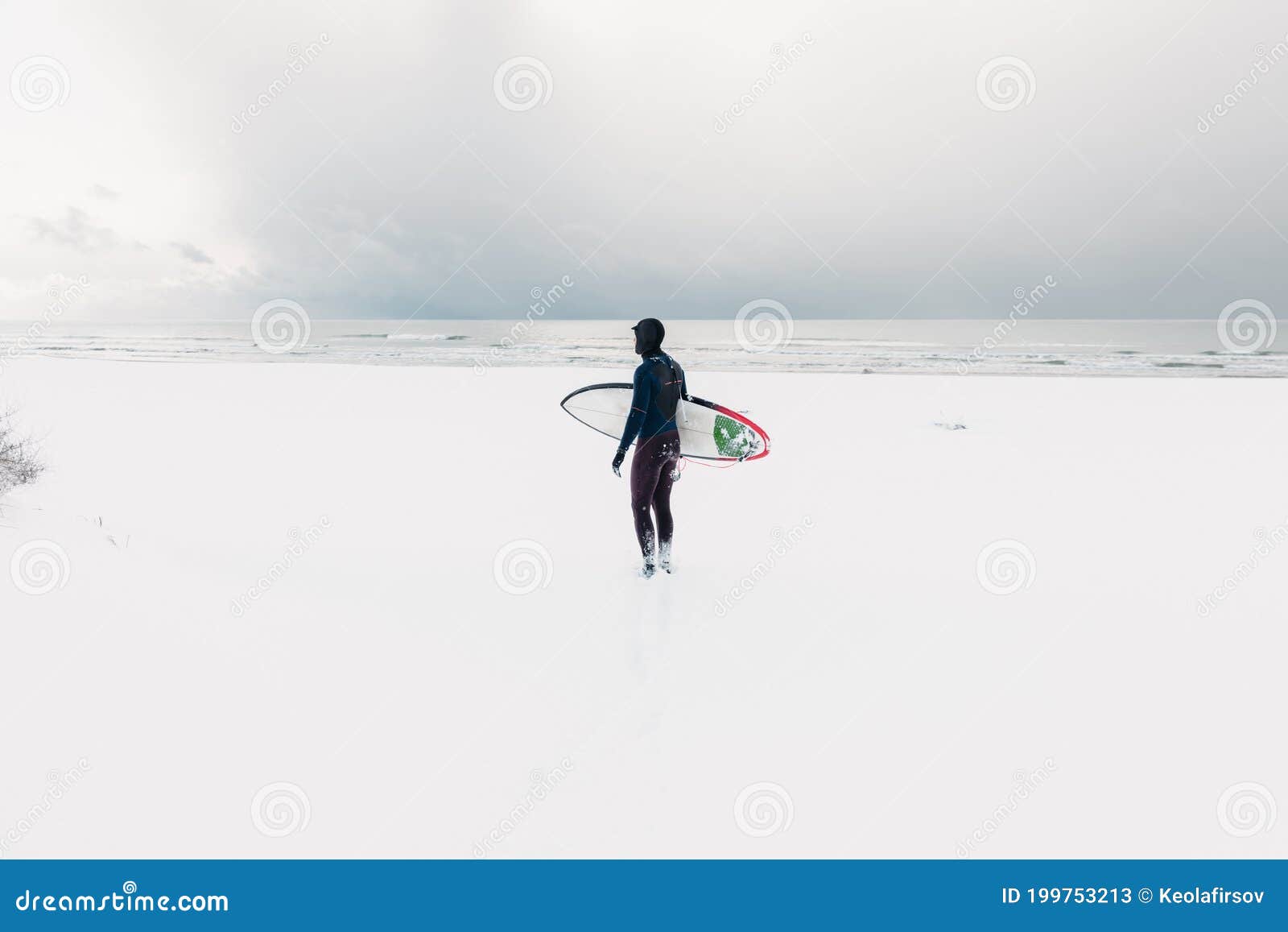 Snowy Winter and Surfer with Surfboard. Winter and Surfer in Wetsuit ...