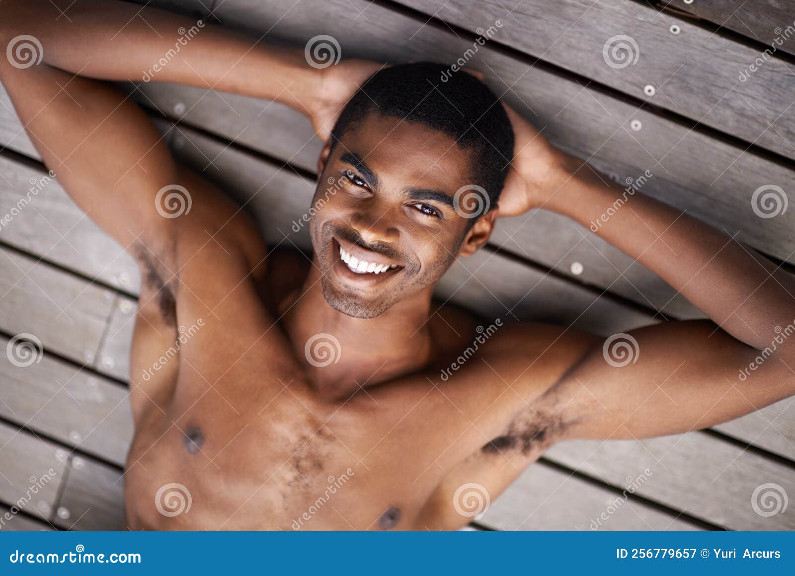 Soaking Up the Summer Sun. a Young Man Reclining in the Summer Sun ...