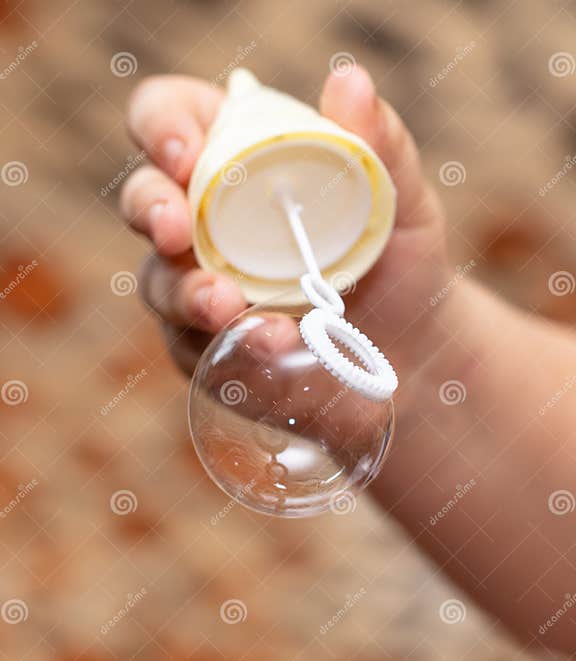 Soap bubble in the hand stock image. Image of play, people - 179256809