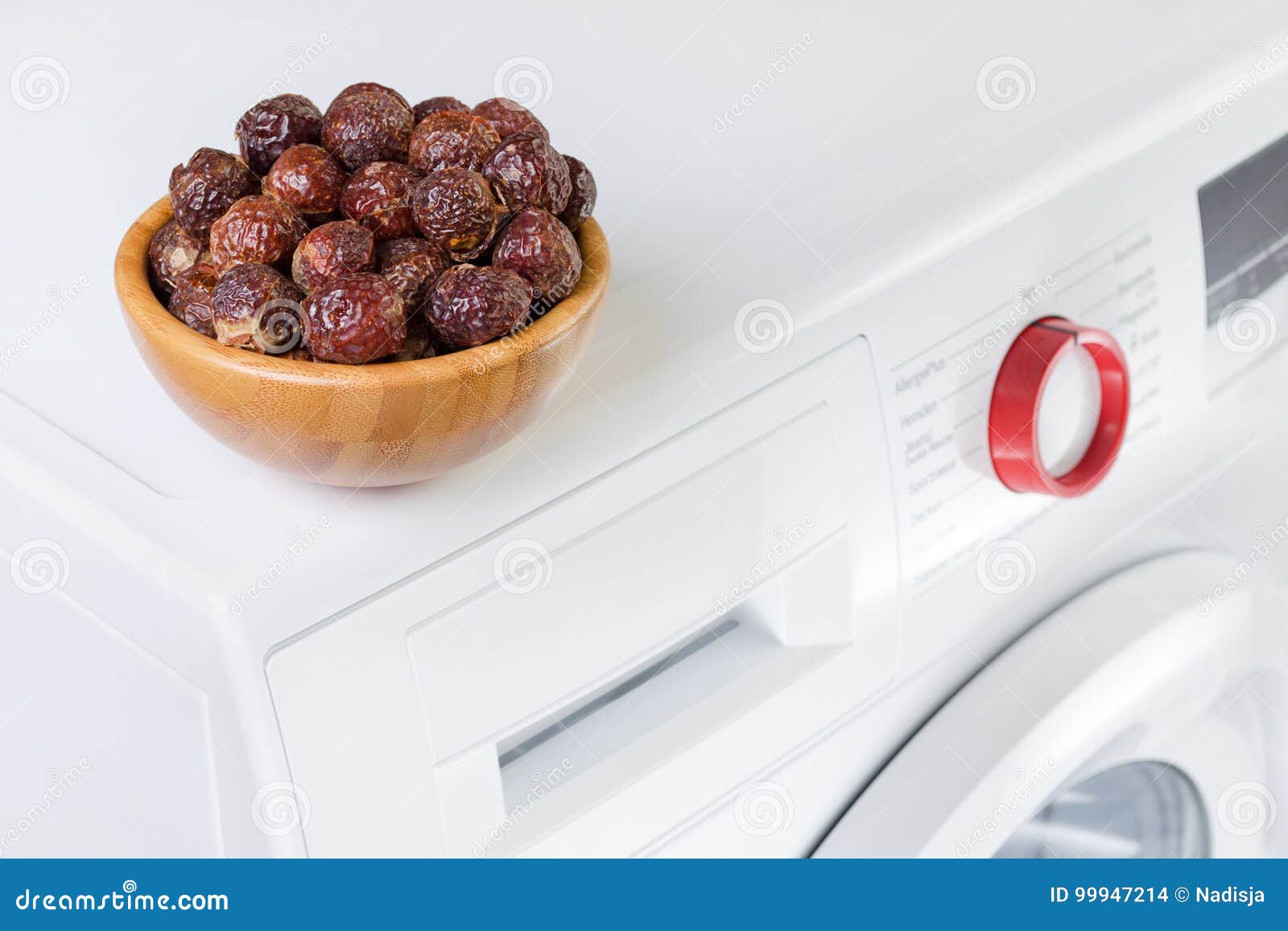 Soap Nuts in a Bowl on the Washing Machine, Organic Detergent ...