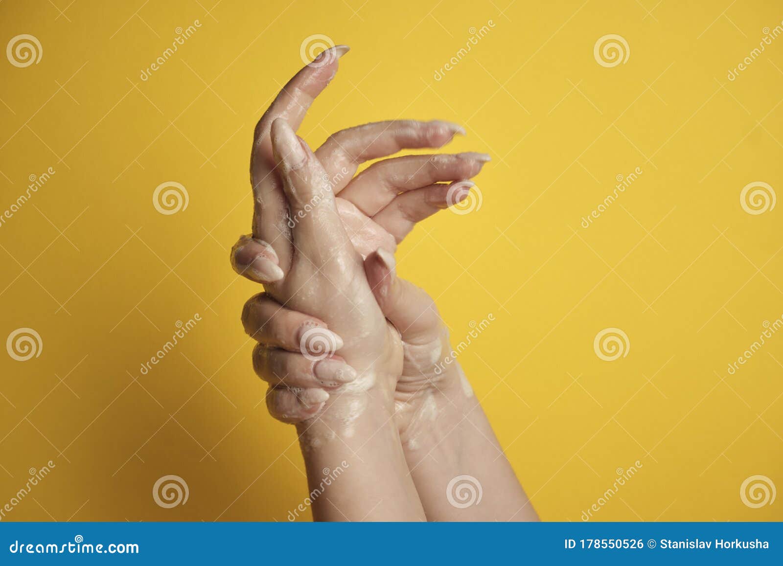 Soapy Female Hand on a Yellow Background Stock Photo - Image of ...