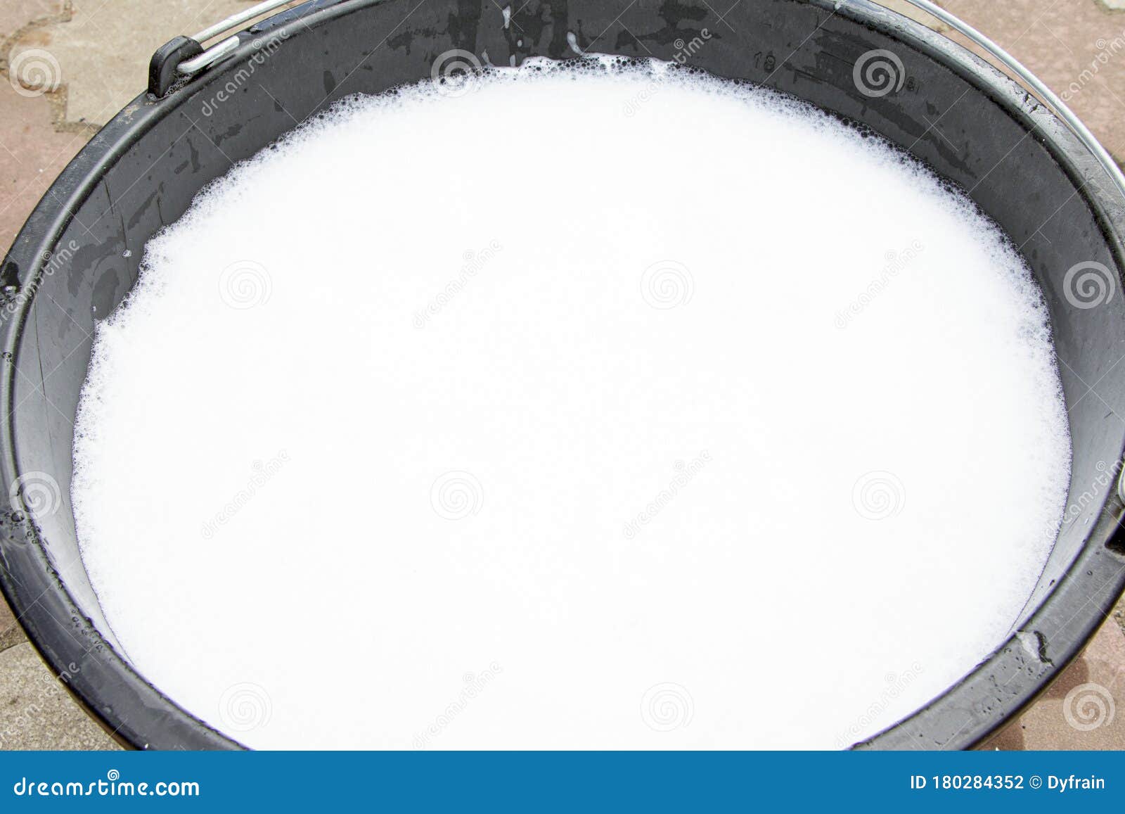 Soapy Water in a Black Bucket. Suds and Soapy Water Stock Photo - Image ...