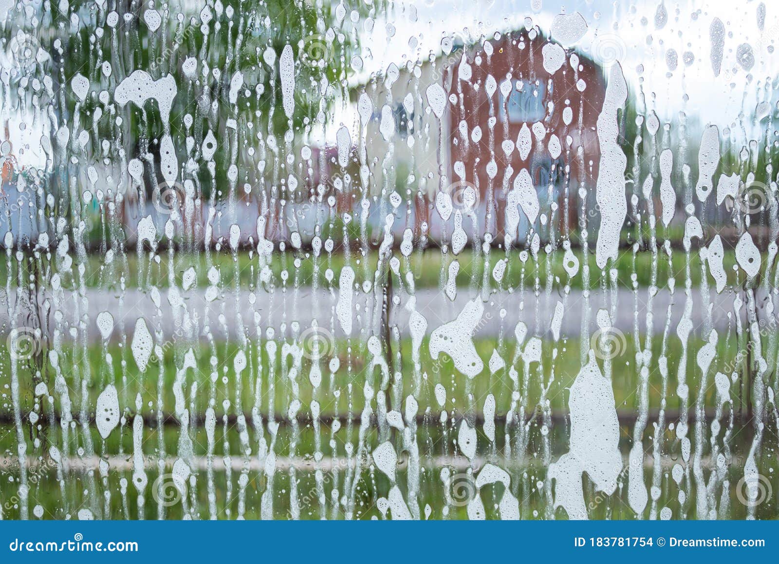 A Soapy Window that is Going To Be Washed. Window with Foam Particles ...