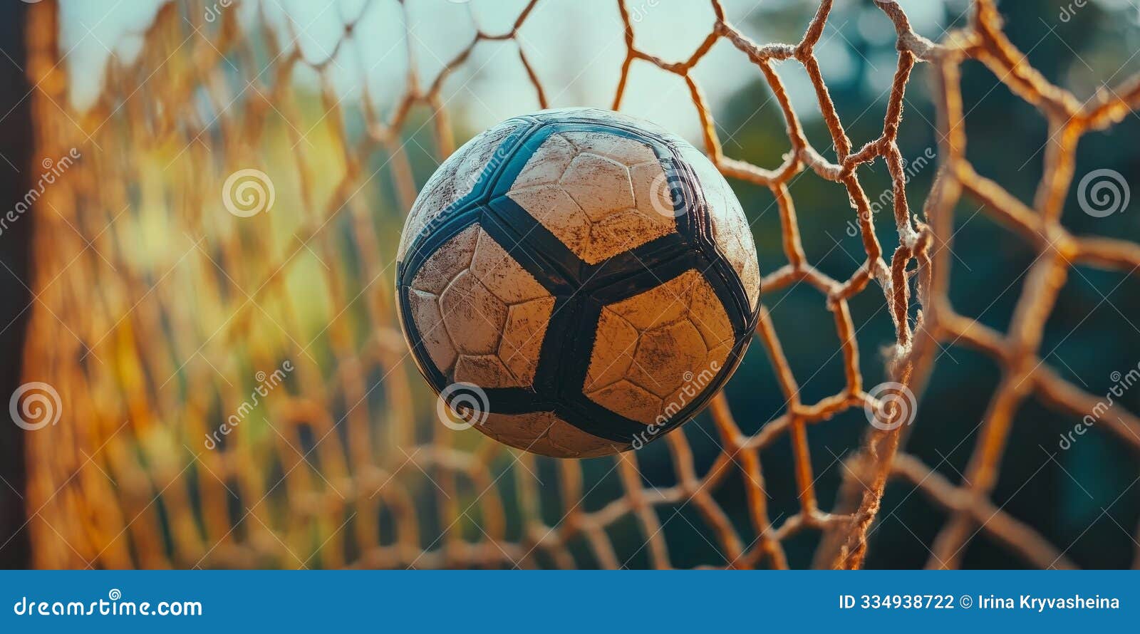 A Soccer Ball Breaking through the Net during an Intense Game on a ...