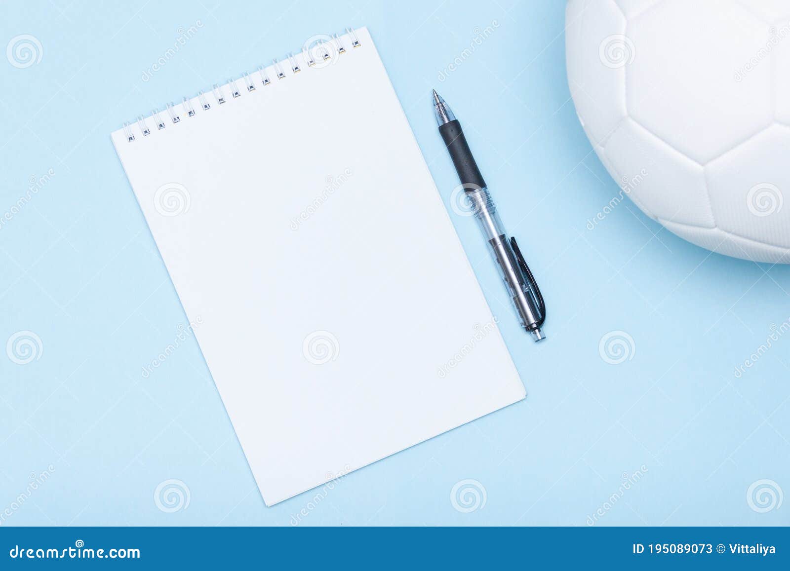 Soccer Ball, Notebook or Paper for Notes, Pen on Blue Background Stock ...