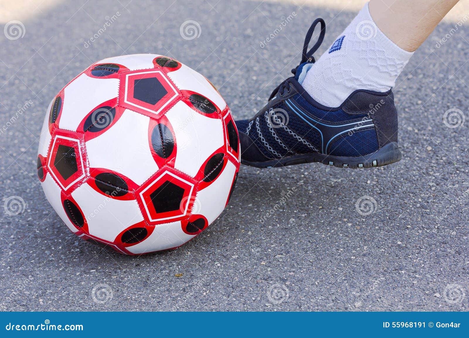 Soccer Ball and One Leg of the Athletes in the Sneakers Stock Image ...