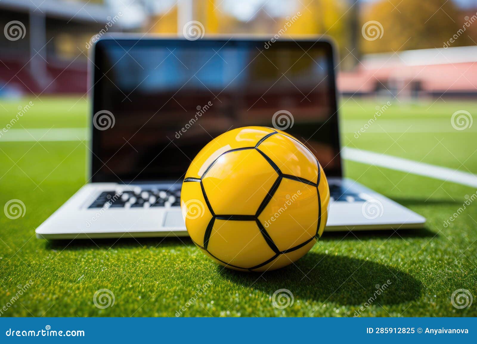 A Soccer Ball Sitting on Top of a Laptop Computer. Stock Image - Image ...