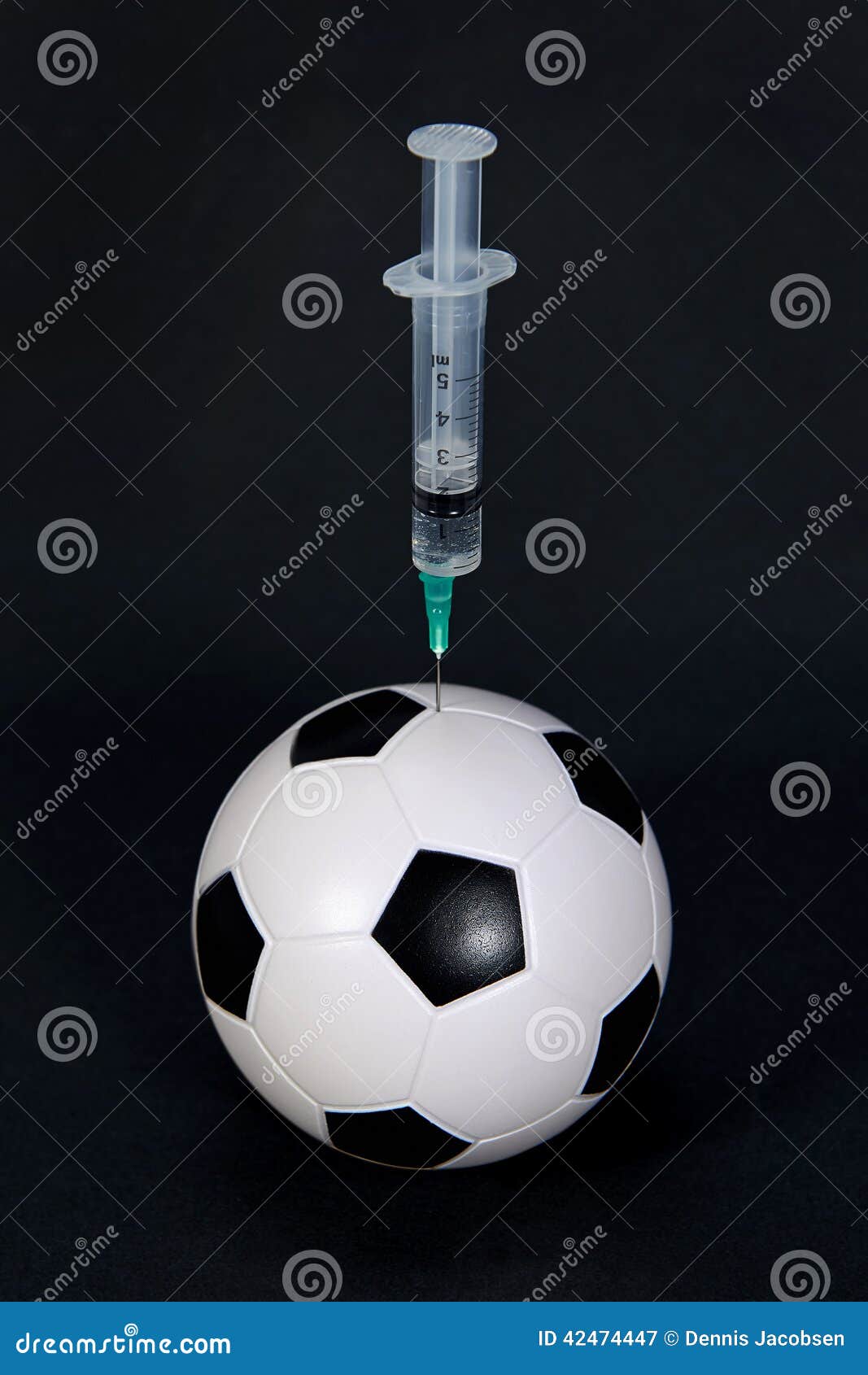 Football, A Syringe In A Soccer Ball And Pills On The Lawn. The Concept ...
