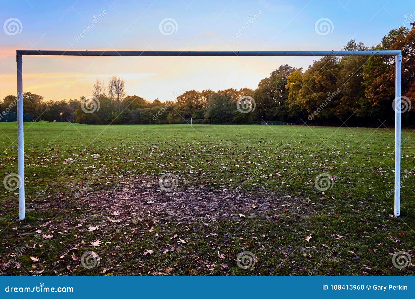 Soccer Field at Sunset in Autumn or Fall, Mud and Leaves on the Ground ...
