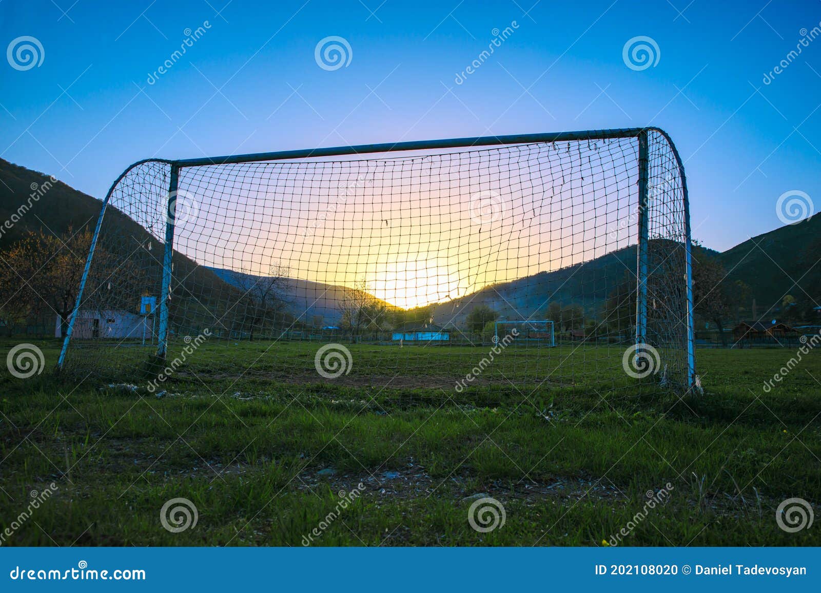 Soccer field at the sunset stock photo. Image of goal - 202108020