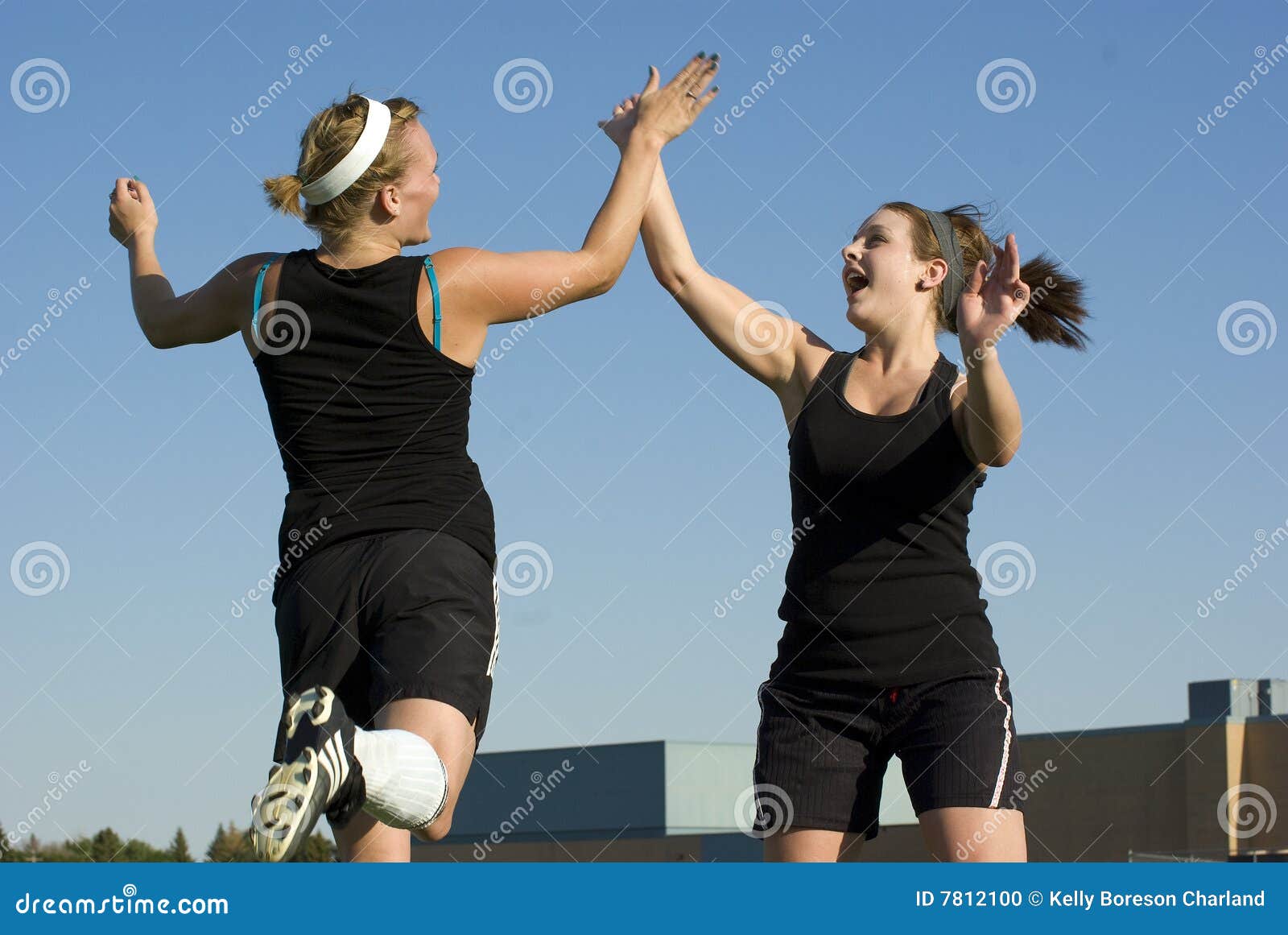 Soccer Girls Celebrate with a High Five Stock Photo - Image of action ...