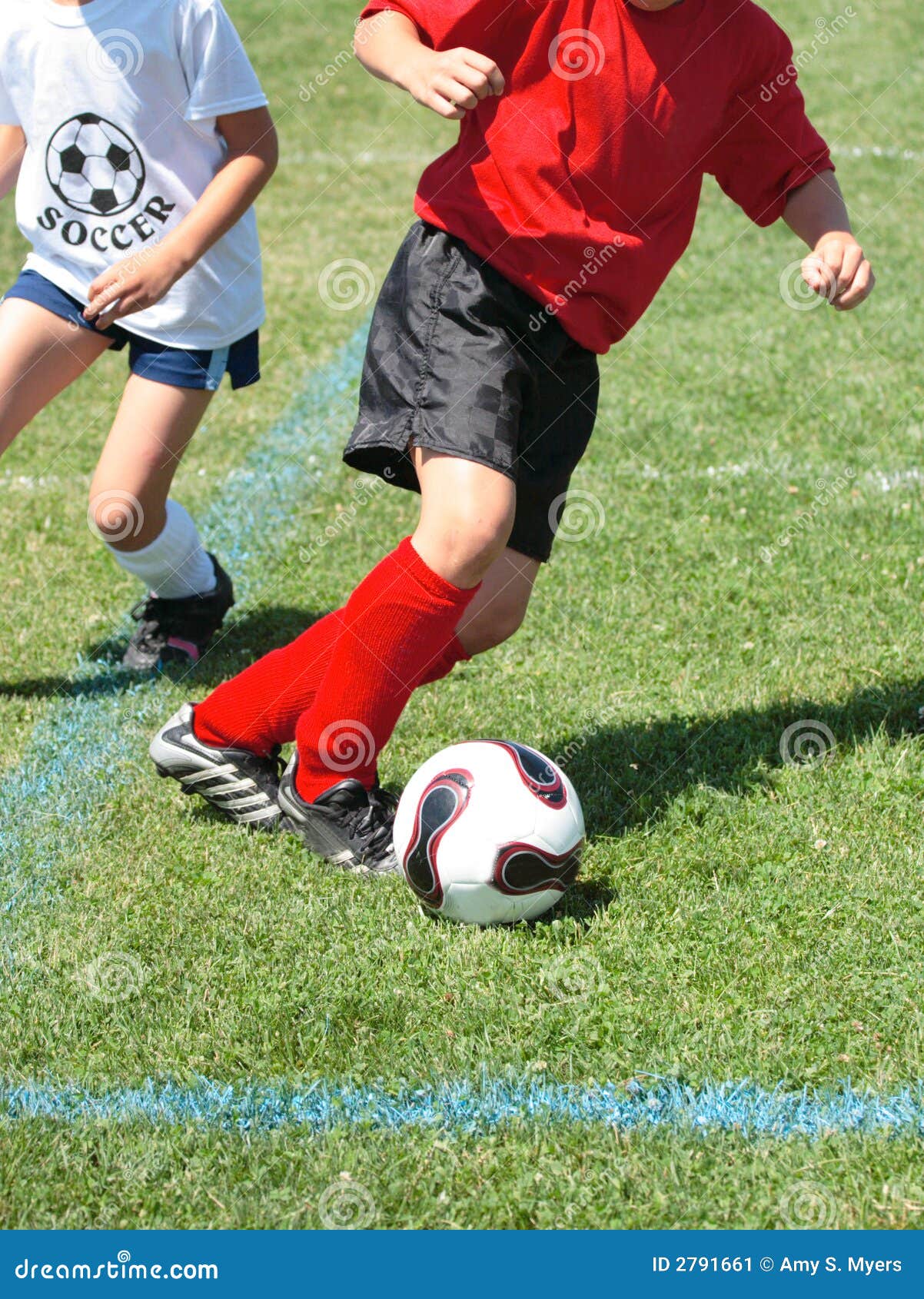 Soccer Player Chasing Ball stock image. Image of grass - 2791661