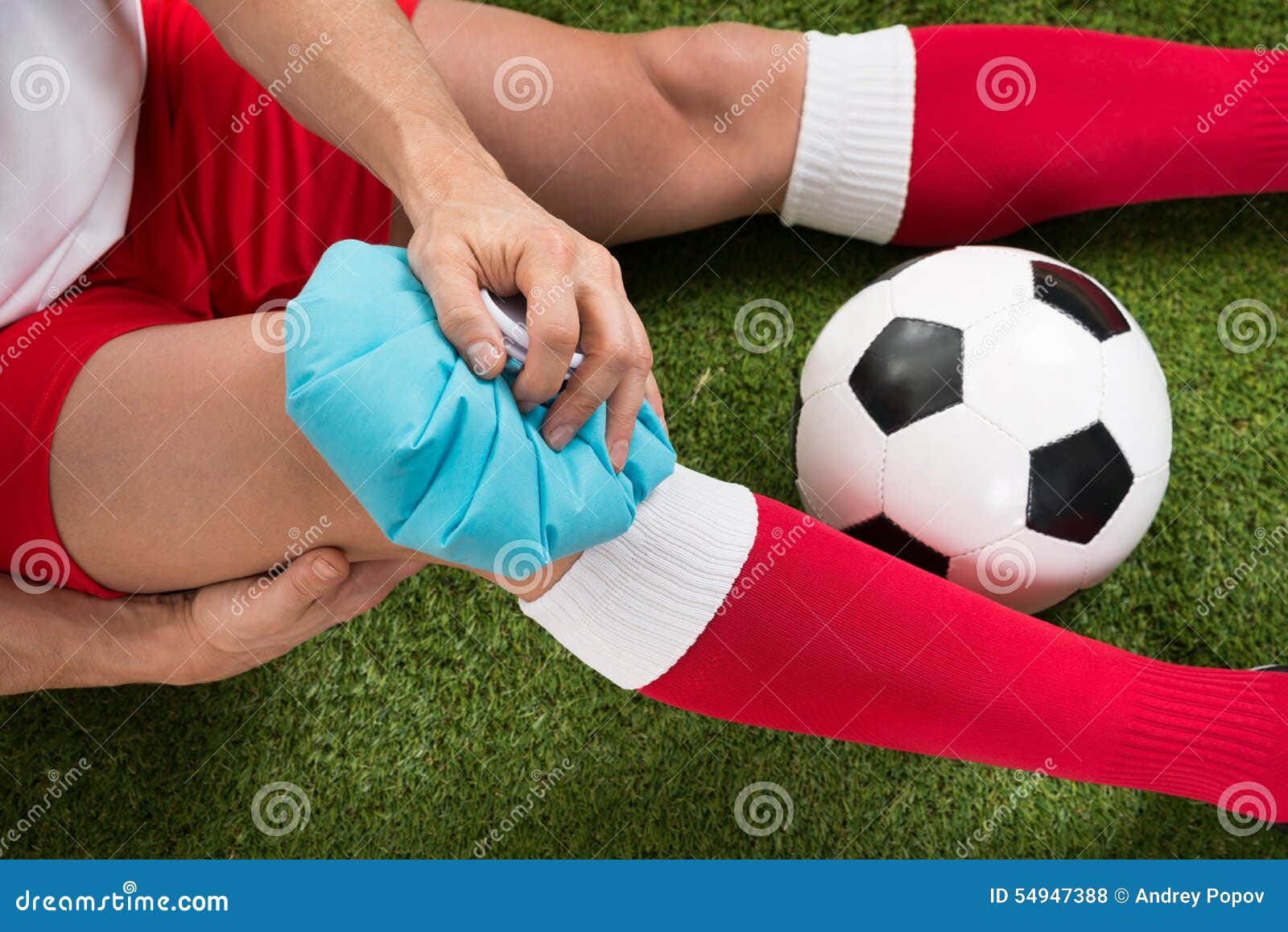 Soccer Player Icing Knee with Ice Pack Stock Photo - Image of ball ...