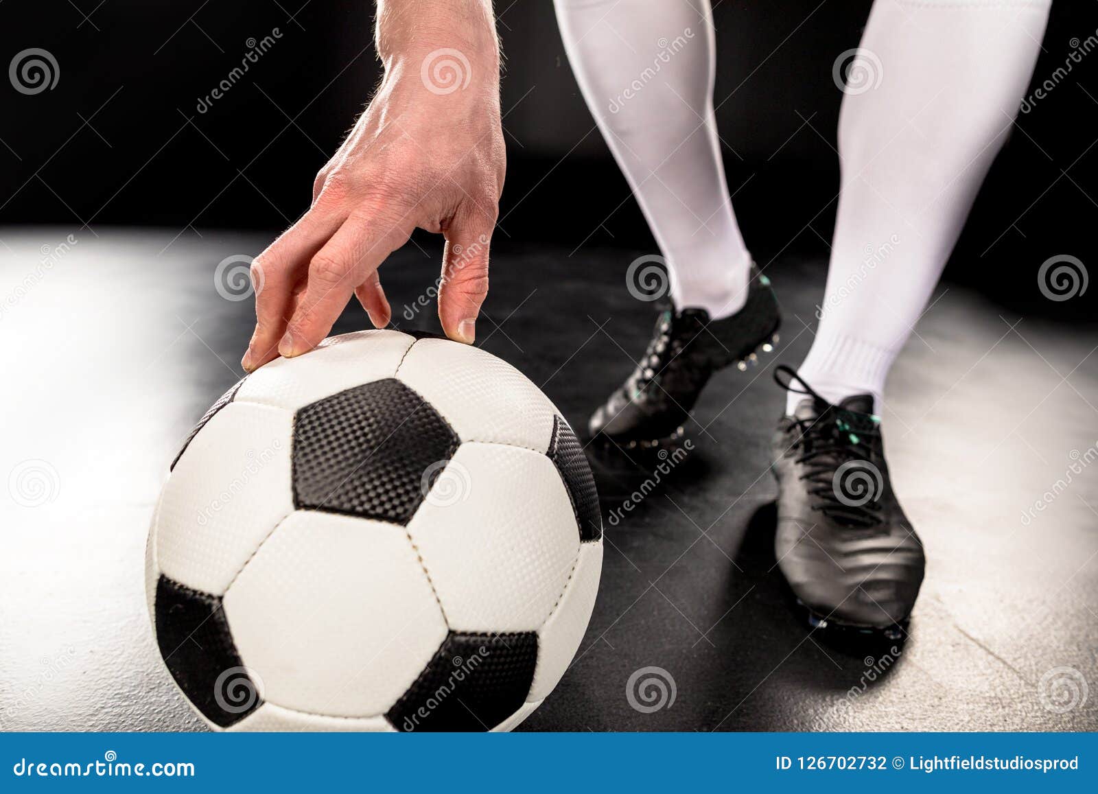 Soccer Player Lining a Ball Up for a Stock Photo - Image of legs, hand ...