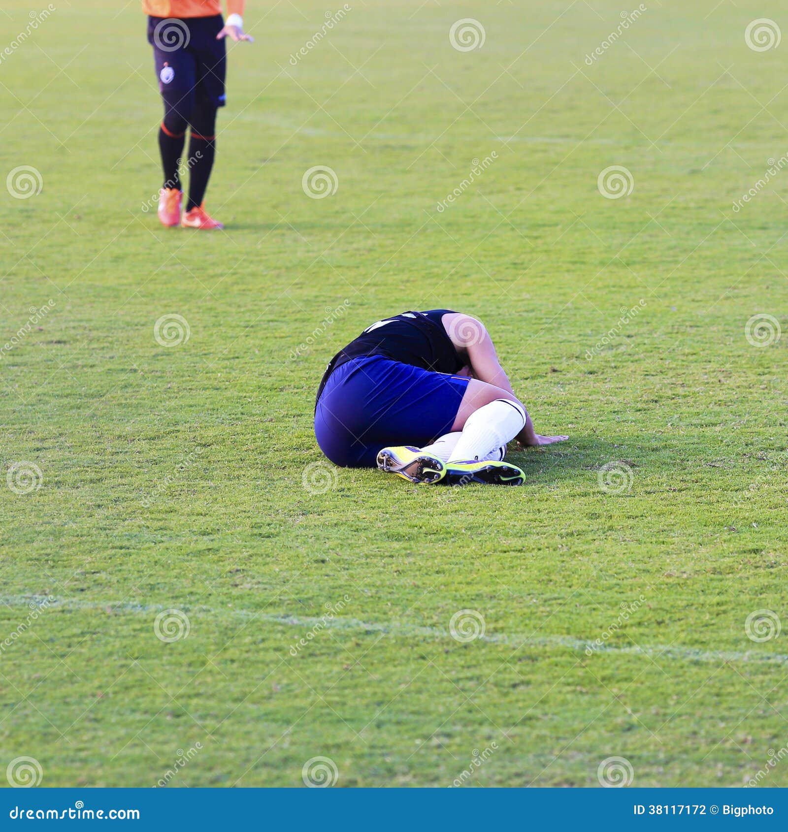 Soccer Player Lying Down on Football Match Stock Photo - Image of ...