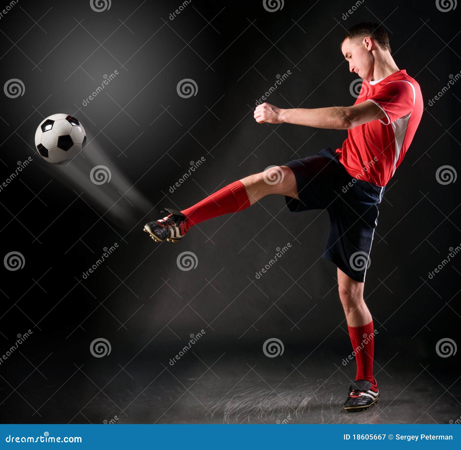 Soccer player strikes stock image. Image of shorts, dark - 18605667
