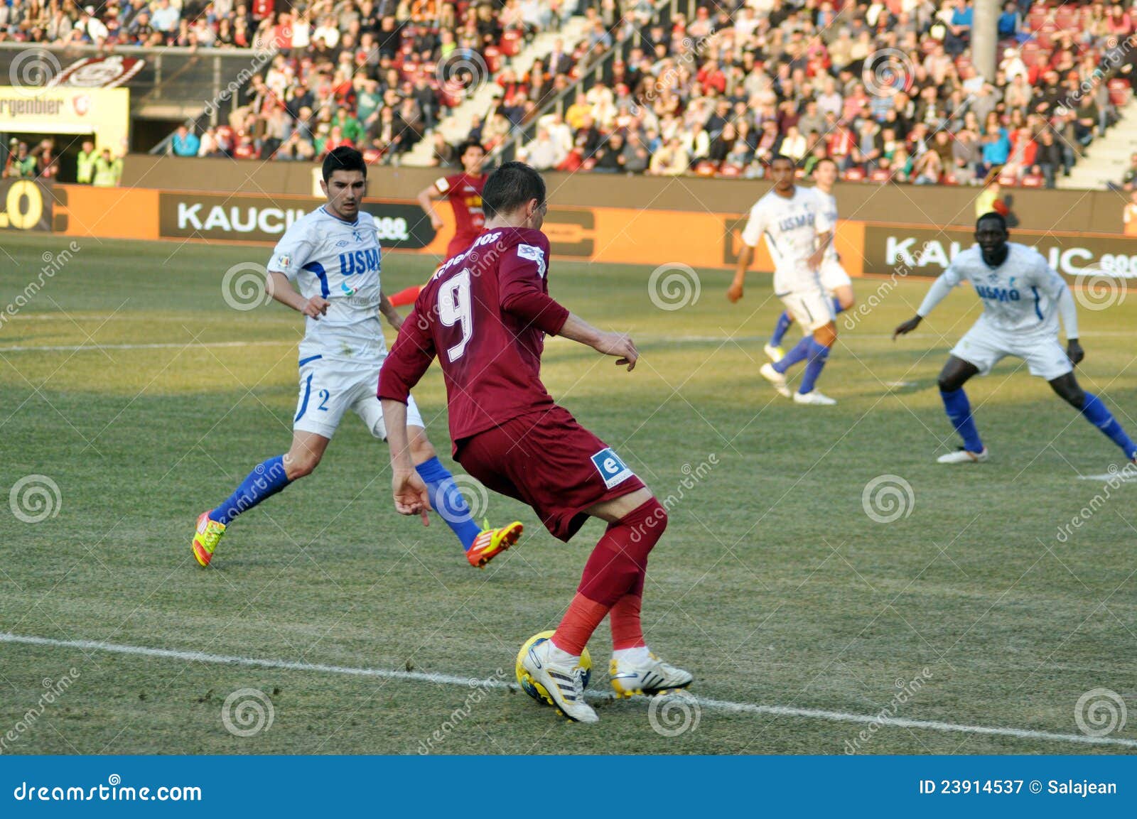 Soccer players in action editorial photography. Image of green - 23914537