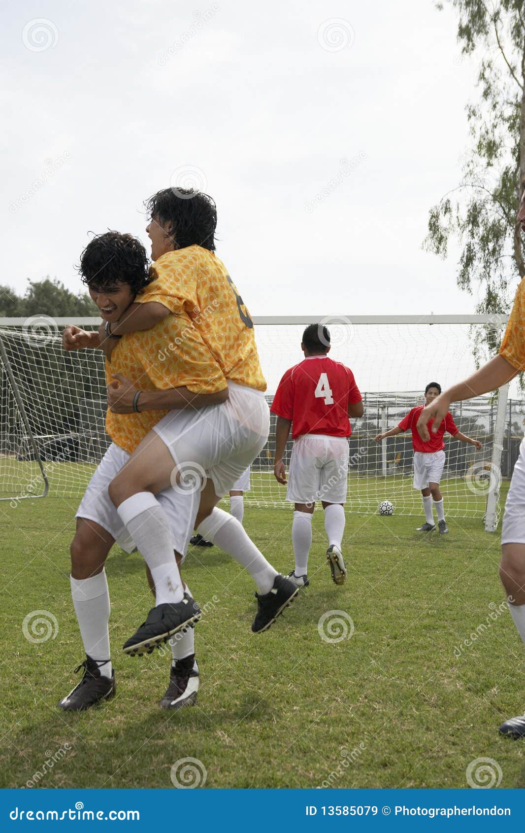 Soccer Players Celebrating Goal Stock Image - Image of camera, years ...