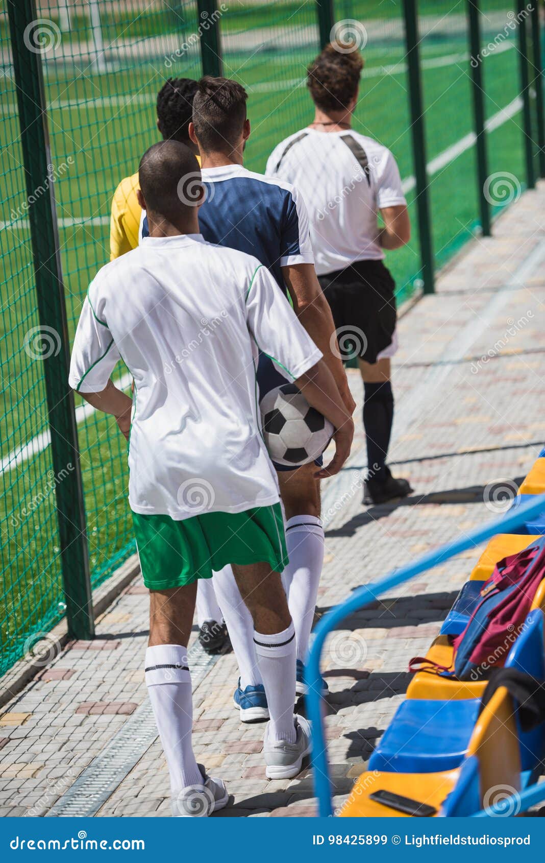 Soccer Players and Referee Going on Soccer Pitch Stock Image - Image of ...