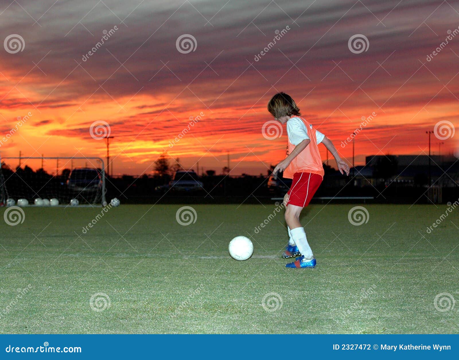 Soccer at sunset stock photo. Image of exercise, ball - 2327472