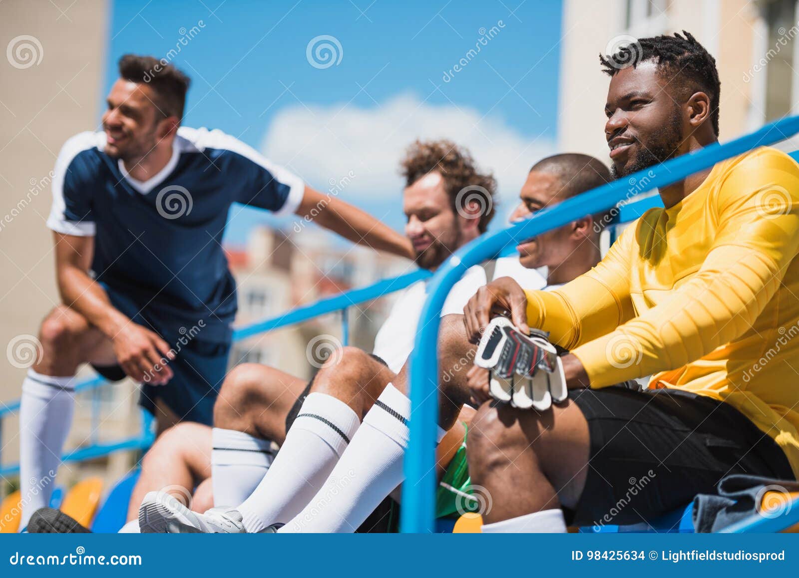 Soccer Team Sitting on Stadium during Soccer Match Stock Photo - Image ...