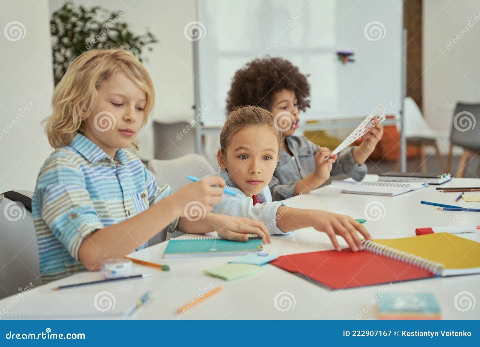 Social Activity. Diverse Kids Sitting Together at the Table in ...