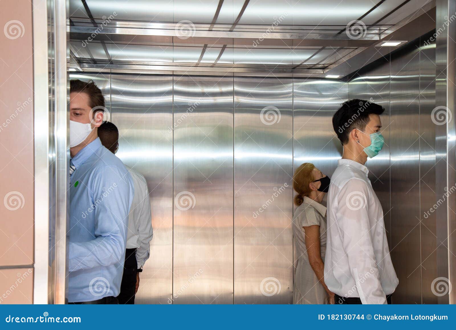 Social Distancing on Elevator with Passenger Stand in the Corner Stock ...