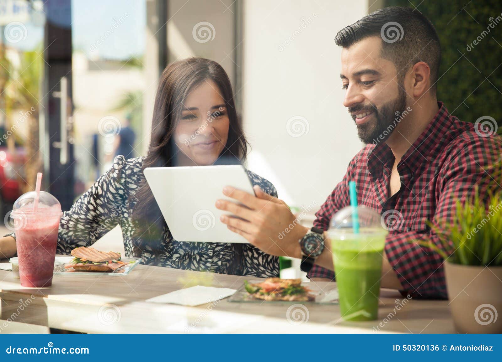 Social Networking at a Cafe Stock Photo - Image of eating, cafe: 50320136
