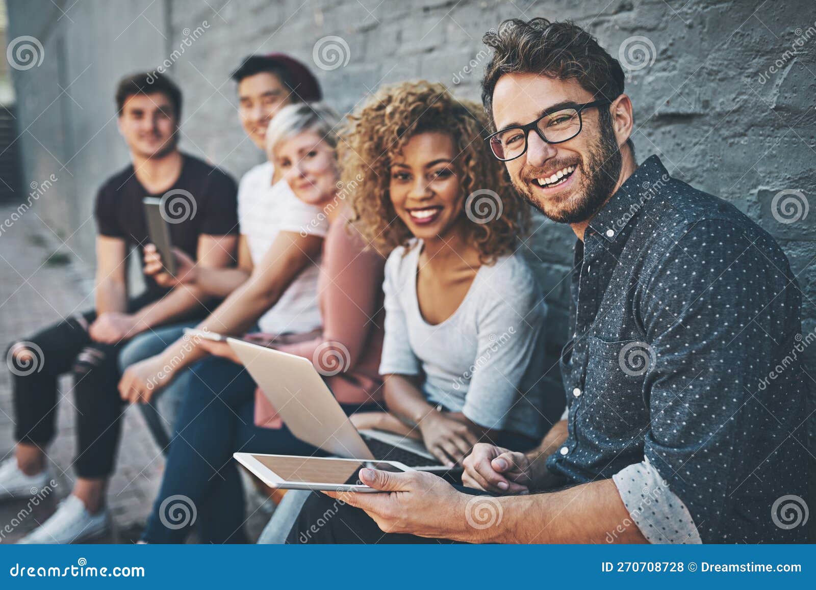 The Social Networking Row. Shot of a Diverse Group of People Social ...