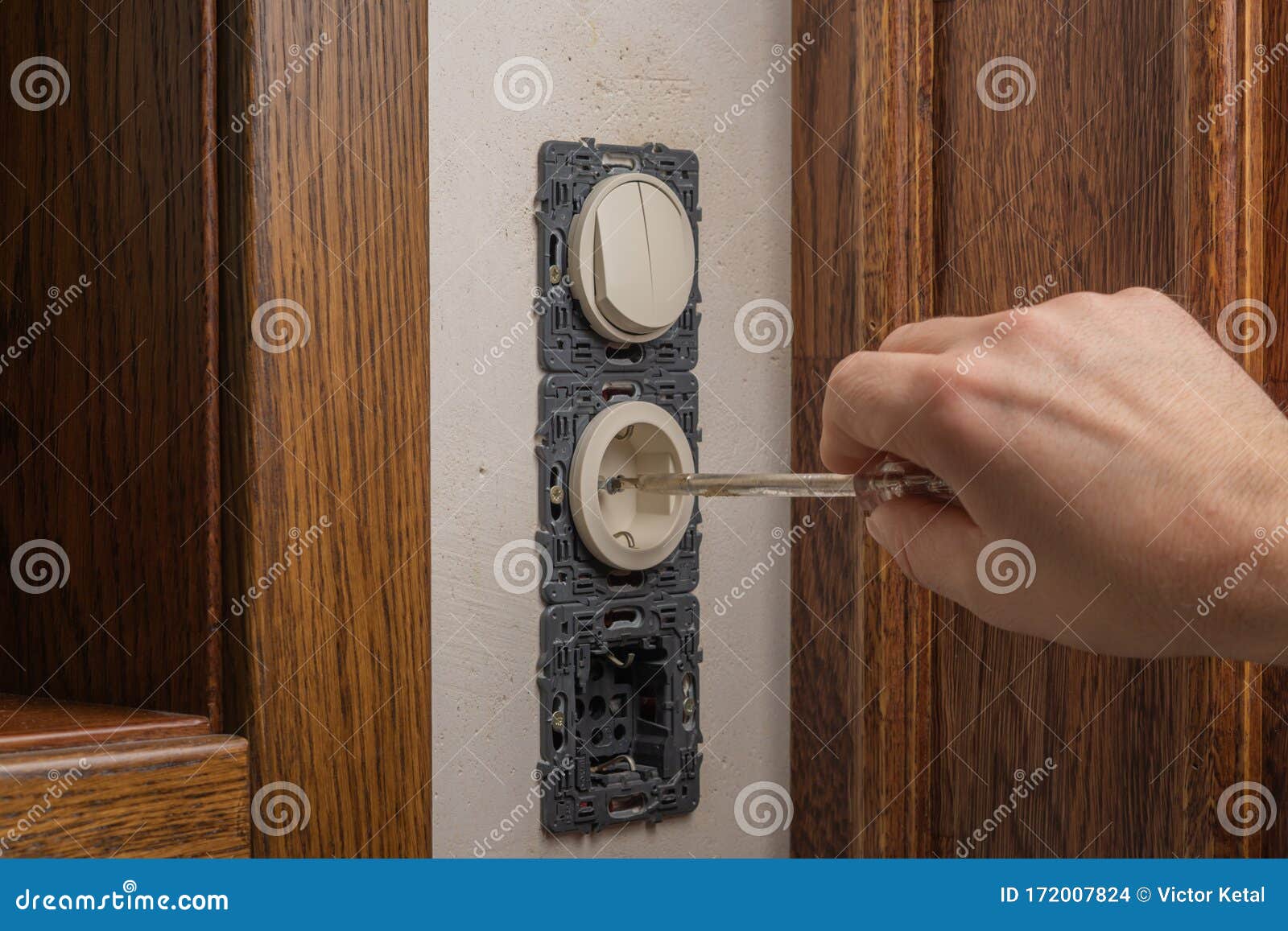 Socket Installation. a Master Electrician Installs an Electrical ...