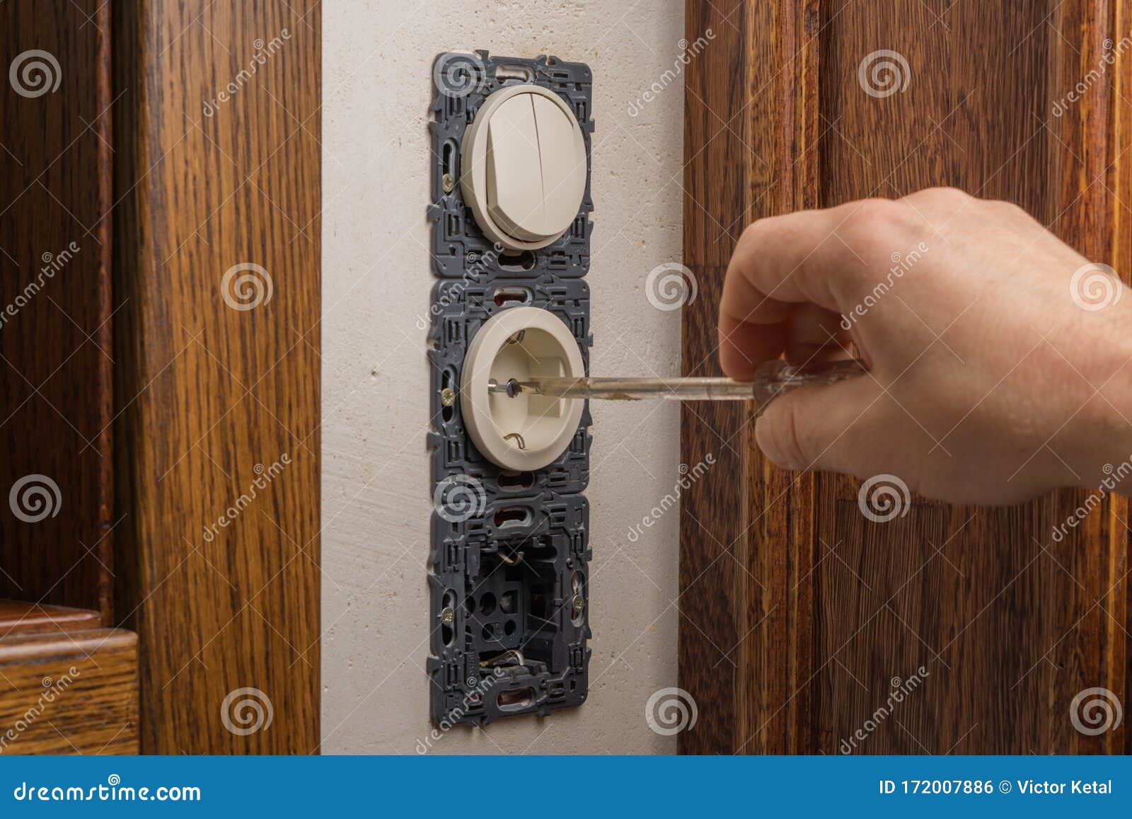 Socket Installation. a Master Electrician Installs an Electrical ...