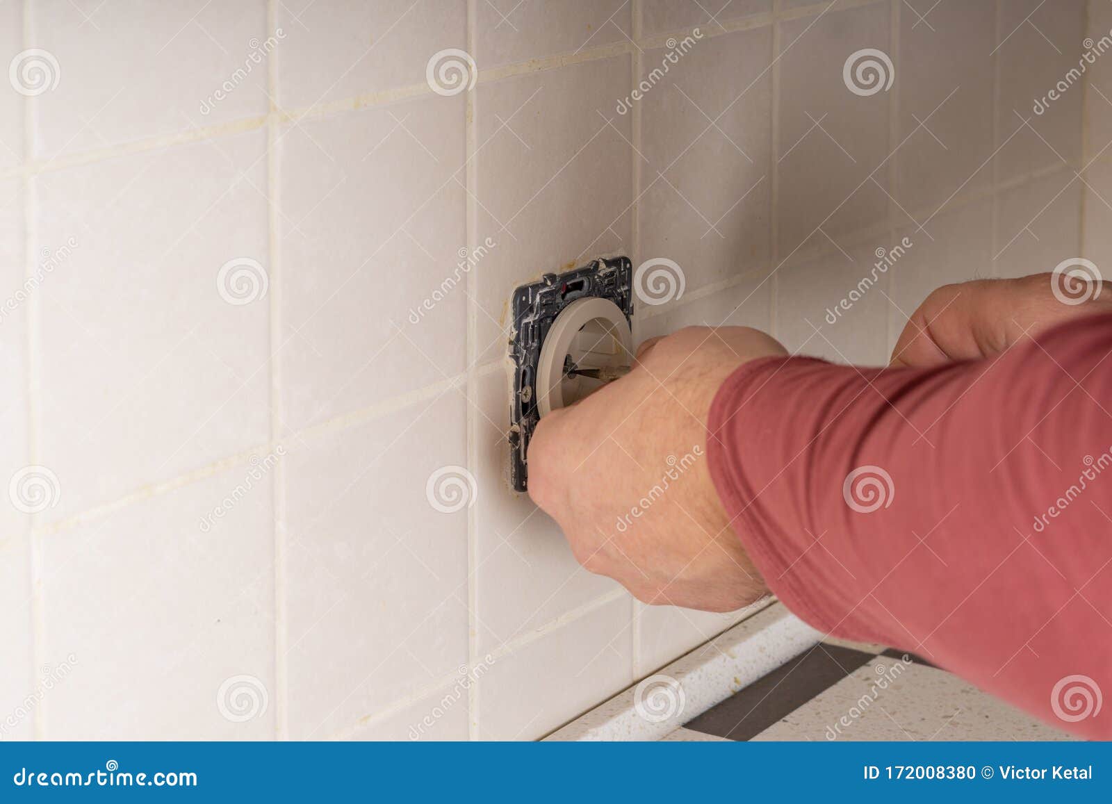 Socket Installation. a Master Electrician Installs an Electrical ...