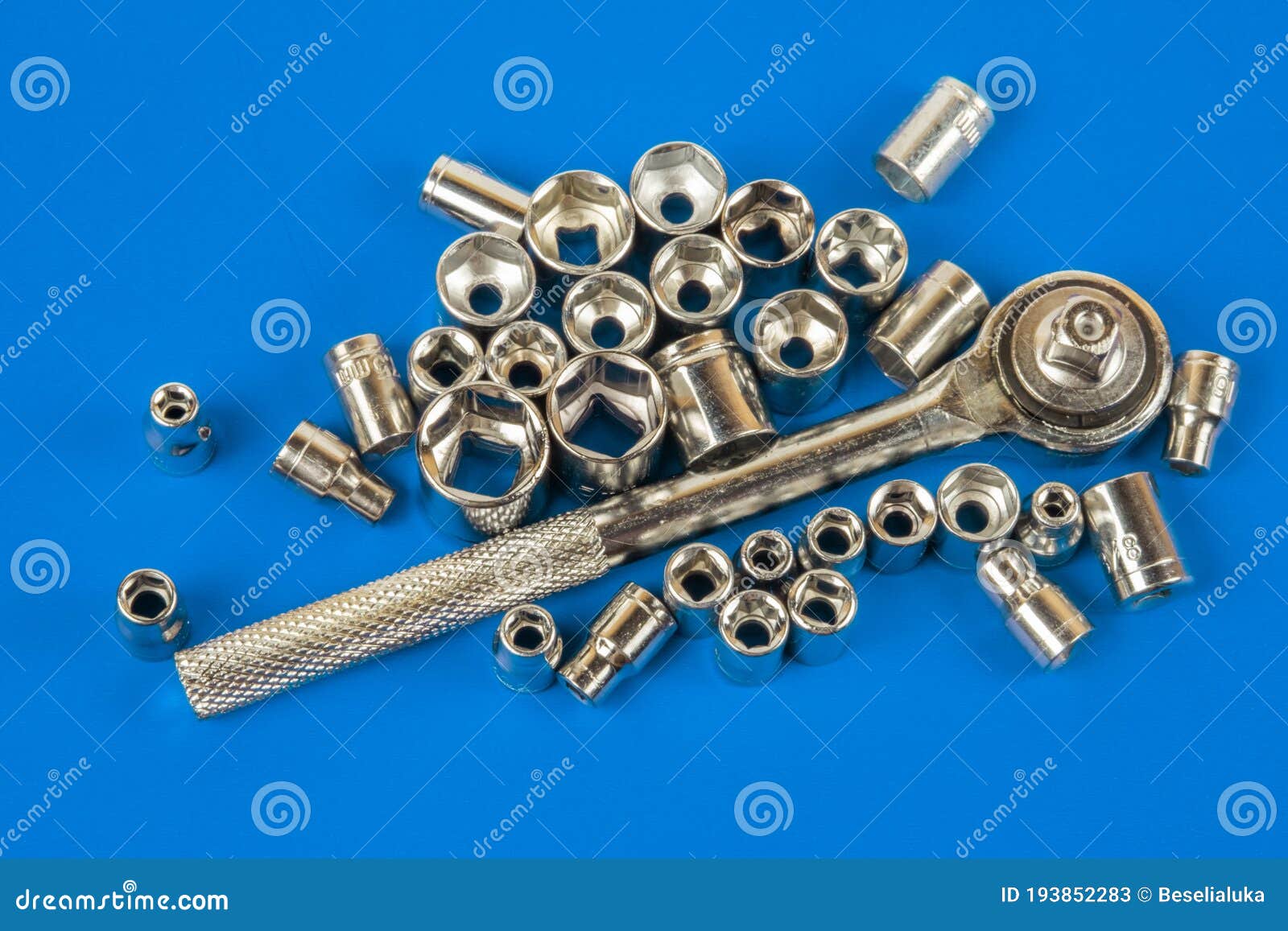 Socket Spanner Wrench and Various Wrench Heads Closeup on a Blue ...