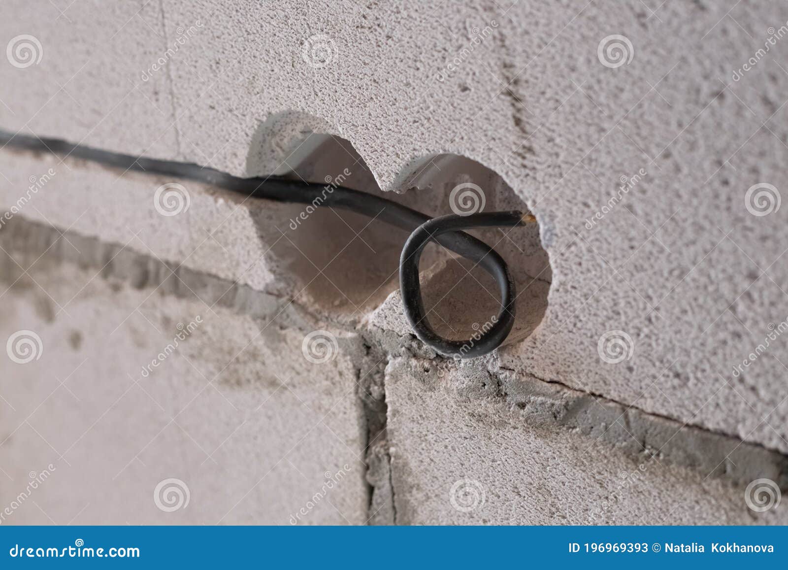 Socket with a Wire in Aerated Concrete for an Electrical Outlet. House ...