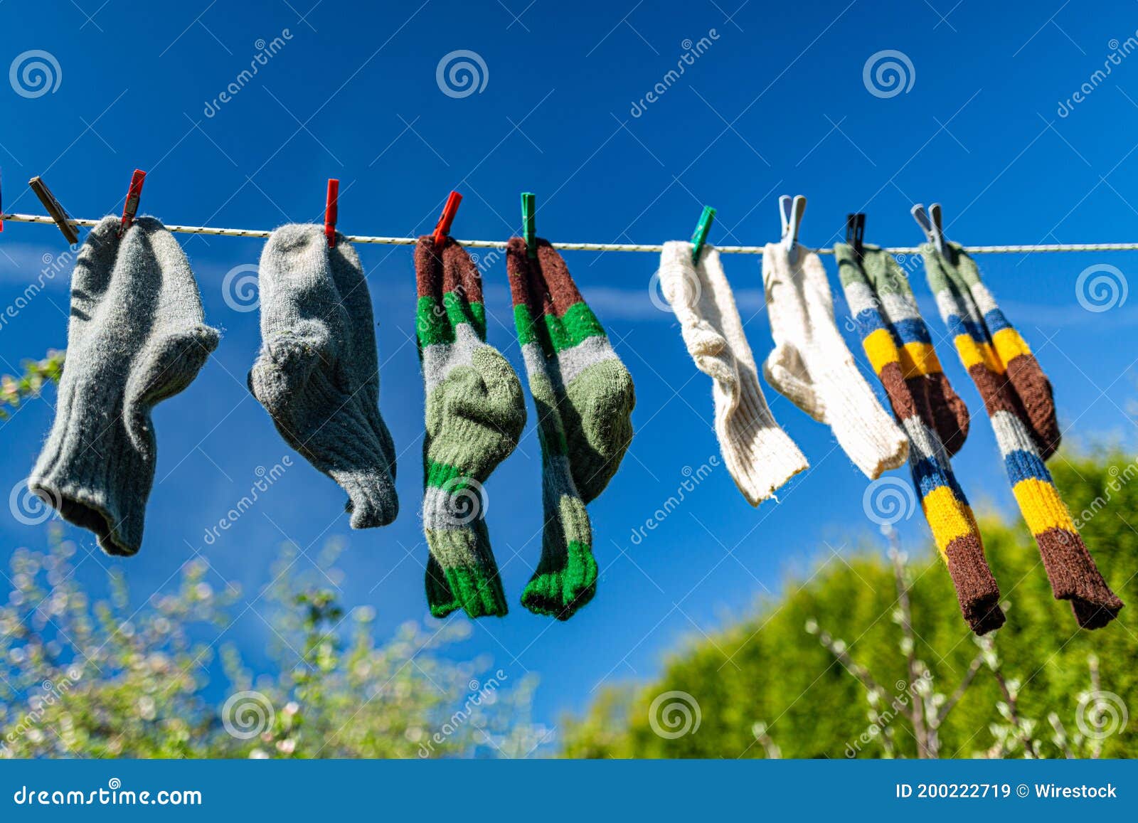 Socks hanging on the rope stock image. Image of home - 200222719