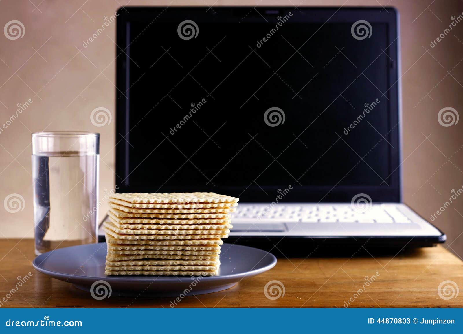 Soda Crackers, Glass of Water and a Computer Stock Image - Image of ...